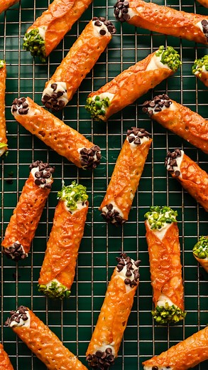 Lexi Harrison & Beth Sinclair on Instagram: "Florentine Cannoli for Day 21 of our Recipe Advent Calendar! 🎄 Comment ‘RECIPE’ and we’ll send the recipe straight to your DMs 💌 A few days ago, we were testing a batch of Florentines (aka lace cookies) when we realized that they work surprisingly well as cannoli shells! If you’ve never had a Florentine or lace cookie, they’re super thin, crispy, caramel-flavored cookies that often contain chopped nuts. We like to make ours with honey, and for this
