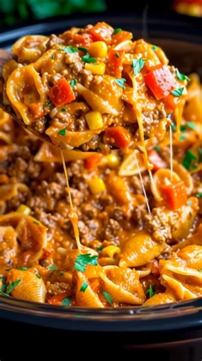 Crockpot Taco Pasta Ingredients: - 1 pound lean ground beef - Salt and pepper - 1 bell pepper, chopped - 15 ounce can crushed tomatoes - 1 cup jarred salsa (mild) - 15 ounce can corn, drained - 3 tablespoons taco seasoning - 2 ½ cups water or low-sodium chicken broth - 12 ounces shell pasta shapes (uncooked) - 1 cup shredded cheddar cheese Directions: https://recipesdina.com/crockpot-taco-pasta-easy-cheesy-comfort-food/ | Tested Recipes