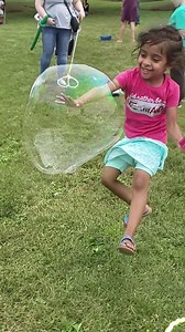 Aravind Bhonagiri caught his daughter in a hop to pop another of the bazillion bubbles at the 190615- Free Bubble Festival, Collegeville, PA, with Food Trucks... ~~ Send in your photos to enter the contest to WIN a free BUBBLE PARTY. Email or Share your cloud folder of bubbling photos to grandpopbubbles@gmail.com. | Grandpop Bubbles