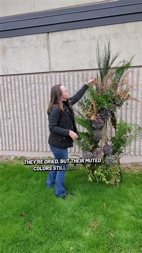 Foraged greenery plus dried local hydrangea blooms in this standing funeral floral arrangement.