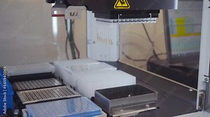 Automation in the clinical laboratory. Pipetting robot laboratory. Medicine robotics. automated pharmaceutical laboratory. Research and science background