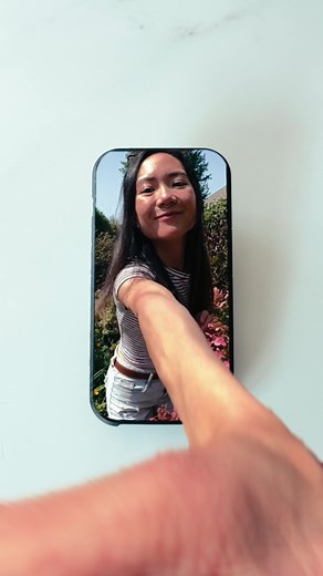 How to get this pulling out of the phone effect: - Shot one - take a picture of your phone with a green background - Shot two - set your phone to 0.5x zoom video, reach for phone and pull it towards you - Remove green screen from shot one - Duplicate shot 2 and put it above and below shot 1 on your timeline - In the top layer, find where your hand starts reaching for the phone and make a cut. Delete the front clip - For the back clip, magic mask your hand so that it looks like it reaches outside