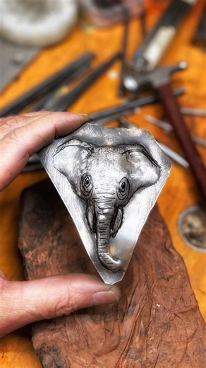 Susan Urquhart on Instagram: "Working on another repoussè piece today! Repoussè is an ancient metal forming technique that allows me to sculpt with 24 gauge sterling silver sheet, which is pretty thin. Here I’m working on the initial puffing out of my form, working from the back and using a block of plasticine clay to support the silver. Not shown is all the annealing in between. Now that that’s done I’ll start working from the front in my pitch bowl, which is where the magic happens. #handmadej