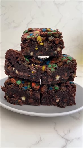 Sophia’s Goodies 🍭🍪 on Instagram: "Mini M&M Brownies 🤩🍭 A gooey, fudgy batter stuffed to the brim with Mini M&M’s. Then we have a crackly top to finish & lots more M&M’s. Could this bake get anymore perfect?🤩 Would you like the recipe? Comment YES or NO?✨ Don’t forget to follow @sophsgoodies for lots more delicious baking content 🫶🏻 #minimandms #mandm #mandms #brownies #ukbaker #ukfoodie #uk #reels #love #brownies"