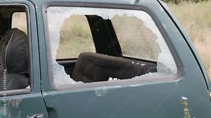 Car with broken Windows. Accident abandoned old car. Side view.