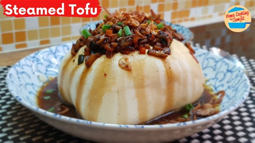 Learn how to cook this delicious, 8-minute vegetarian recipe - Steamed Soft Tofu with Shiitake Mushrooms. The tofu is so soft, creamy and smooth, paired with the sweet-salty-savoury shiitake mushrooms and carrots. So good with fluffy white rice. Enjoy! Ingredients ↓ Serves 4. Ingredients: 1 block Soft Tofu 3 pieces Shiitake Mushroom 2 tbsp Carrot, chopped 1 tbsp Spring Onion 2 tbsp Light Soy Sauce 1 tbsp Onion Oil 1 tbsp Crispy Fried Onion 1/4 tsp Sesame Seed Oil 1/8 tsp Ground White Pepper 3 tb