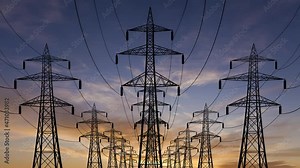 High voltage power line towers at sunset. Timelapse.