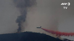 Firefighters battle the fast-moving Holy Fire near Lake Elsinore, California, as wildfires rip across the state. | AFP News Agency