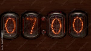 Vintage clock showing 06.59 changing to 07.00 o'clock. Alarm clock at 7 a.m. - time to wake up.