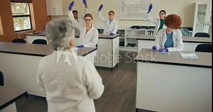 Professor, students and question in science classroom for education, experiment and learning. Teenager, people and classmates with chemicals at lab in high school as future scientists for research