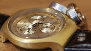 Wedding clock on a table with wedding rings. Time lapse Stock Video