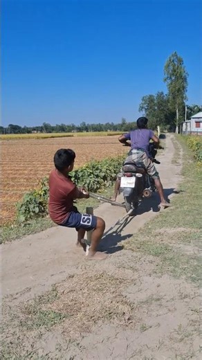 Who tied the rope to the motorcycle wheel?