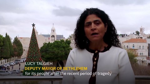 City workers prepare and decorate the Christmas tree in Manger Square in Bethlehem