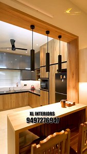 1.6K views · 18 reactions | A stylish U-shaped open kitchen in a chic grey-and-wood combo, designed with a breakfast counter, pantry unit, and oven unit for modern living. | XL interiors | Facebook