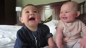 These 2 babies learning how to interact with each other for the first time is the sweetest thing you'll see all day