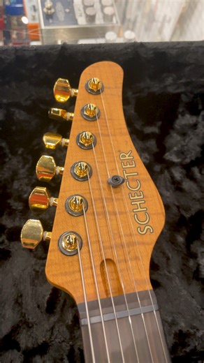 A Strat-style hot rod built like a trophy… and voiced like a weapon. 🗣️ The Schecter USA CET 50th Anniversary Limited Edition Electric Guitar in Golden Anniversary is the real-deal Custom Shop flex: a super-light swamp ash body capped with a 5A quilted maple top with a walnut center accent for snap, shimmer, and ridiculous stage presence wrapped in Golden Anniversary. Tone-wise, it’s not a one-trick “pretty top” guitar; an HSS setup with a USA SuperRock at the bridge plus MonsterTone pickups in