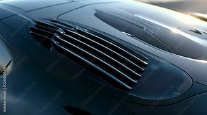 A closeup of the spoilers textured surface as it adjusts to different speeds highlighting the aerodynamic function and efficiency of this active element.