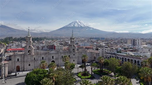 Aerial view of the Plaza de Armas in Arequipa and the Misti volcano with snow during the rainy season