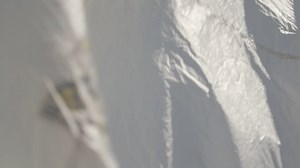 Sails on a sailboat flapping in the wind.