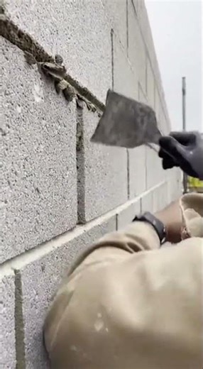 Removing Excess Mortar from Concrete Walls #DIY #HomeImprovement #ConstructionTips