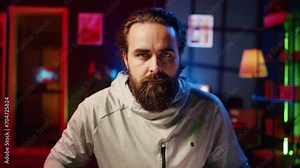 Focused man playing videogames at home, spamming keyboard buttons trying to defeat enemies. Competitive pro gamer trying hard to win online multiplayer esports tournament, zoom out shot