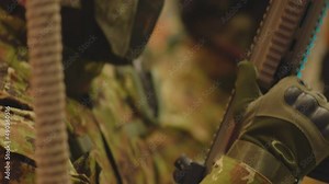 Group of Soldiers or Special Forces Loading weapons and installing Magazine Before Fight . Military , war or strike ball theme concept . Shot on ARRI Alexa cinema camera in Slow Motion . Close up view