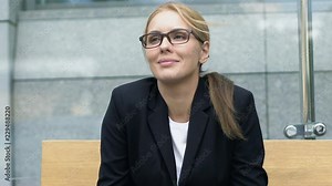 Beautiful businesswoman enjoying fresh air and cool breeze after stuffy office