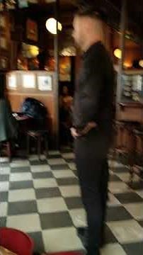 Bar Fight - Irish Pub Confrontation - Bartender Faces Off with Unruly Patron - Caught on Camera