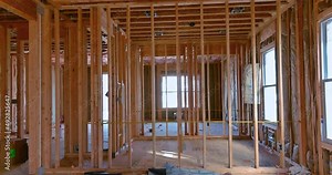 Timber frame house, real estate. stick built home under construction build with wooden truss, post and beam framework.