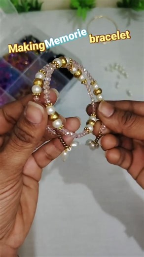 BOHO KNOTS JEWELS on Instagram: "Pearl Charm Bracelet | Pink Crystal Memory Wire 💫 A beautifully handcrafted memory wire bracelet made with sparkling pink crystals, glossy pearls, and golden spacers. The dangling pearl charms give it a soft, elegant finish — perfect for festive wear, gifting, or daily style. 💗✨ Handmade with love by Boho Knots 🌸"