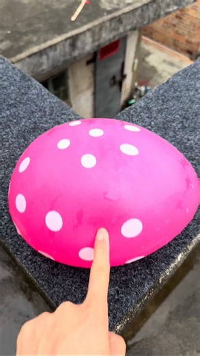 Experiment:will a water balloon explode if it rolls down 👇 from a tall building 🏢 #balloons #tallbuildings #tall #building #balloon #tall | Jr creator
