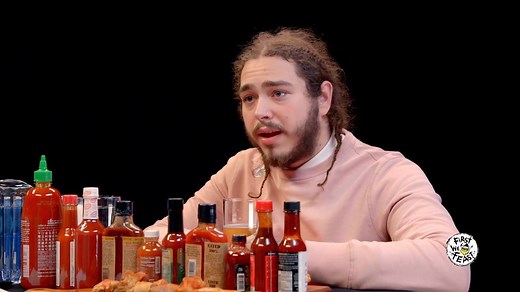 Post Malone ate hot wings while answering hot questions and he kind of held it down. Watch Hot Ones on Facebook. | First We Feast