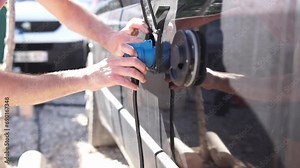 Hands of white man lifting lid cover of blue external plug. RV 240v socket. Camper van Power Plug to network. 220V 230V. 16A IP44. High quality FullHD footage