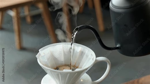 Premium 4K close range coffee brewing footage showing gooseneck kettle pouring steaming hot water into V60 dripper with visible steam crystal clear flow highlighting precision ritual