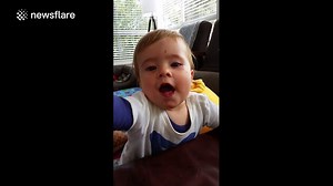 Toddler learns how to blow raspberry