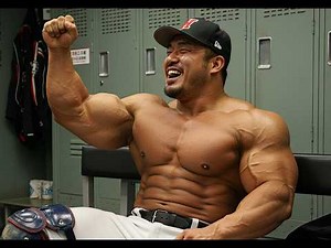 Baseball players sitting on a bench in the locker room