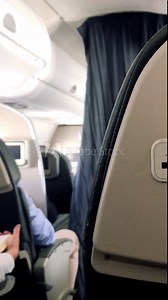 Passenger Plane Monitor with Green Screen on Seat During Flight - Vertical 4K Ending with Zoom