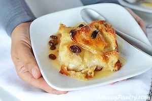 Bread cinnamon mound of soaked raisins vanilla rich custard = probably too much perfection for one recipe. Bread pudding, a comfort food that is old-fashioned, homey with a simple sauce that is out of this world. Don’t we deserve perfection? 😊 Recipe here --> https://amiraspantry.com/traditional-bread-pudding-recipe/ | AmirasPantry.com