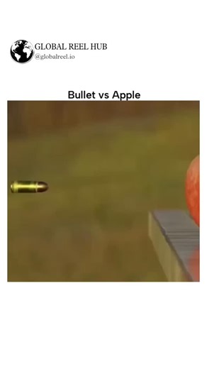 GLOBAL HUB on Instagram: "The X post shares a 11-second slow-motion video of a bullet—impossibly retaining its brass casing—striking and exploding an apple on a wooden surface outdoors, captioned simply "Woah" to evoke surprise. Firearms experts in replies immediately debunk it as AI-generated, noting that casings eject from the chamber post-firing while only the projectile exits the barrel, a basic ballistics principle confirmed by sources like the NRA's firearm mechanics guides. With over 2,10