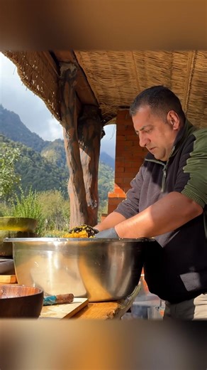 Savor the aroma of pumpkin rice cooked over an open fire, creating a rustic and heartwarming meal. #OutdoorCooking #PumpkinRice #OpenFireCooking #Cooking | Wilderness Grill