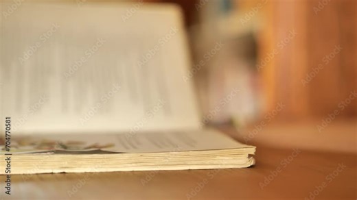 Old books.Rare valuable books.Reading and education concept. Hands leaf through the pages of an old book, close-up.Fairy tales, myths and legends