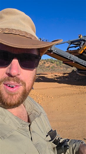Just fired up the crawler crusher! ⚡️ Some of the stuff coming out is looking really interesting—these black rocks even have tiny specs of gold in them ✨. We’ll pick them out, bag them up, and get them tested soon. | Complete Prospecting
