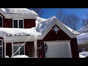 Teen Girl uses SnowPeeler Snow Rake to Clear Roof in MINUTES!