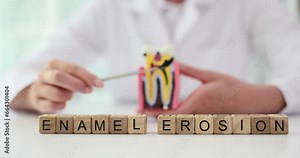 Dentist word tooth enamel erosion and dental treatment. Tooth erosion causes, symptoms, diagnosis and treatment
