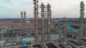 Distillation columns at a plant for processing oil and gas into fuel and plastic. Aerial view of the pipeline and coolers at a large oil refinery. Fuel crisis in industrial Europe.