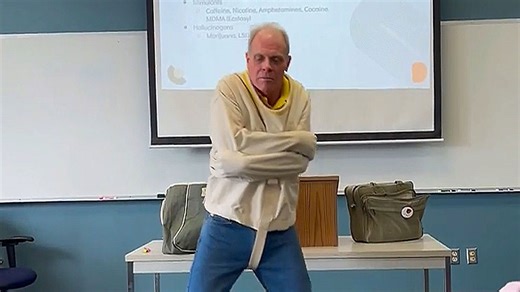 Psychology professor escapes straitjacket