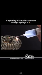 The phenomenon observed in the video is a result of gas ionization under the influence of a high-voltage electric field, likely generated by a Tesla coil. When the syringe is partially evacuated, the reduced pressure allows free electrons to travel longer distances without frequent collisions. As the high-voltage field from the Tesla coil interacts with the syringe, it accelerates these electrons, which then collide with gas molecules inside, ionizing them by knocking out more electrons. This cr