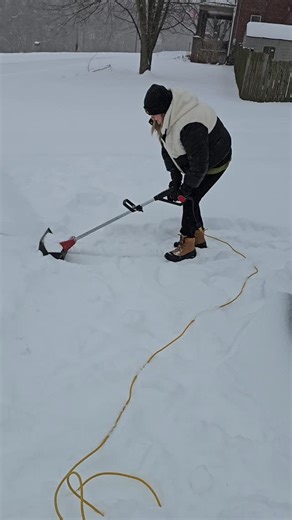 @karahxkay using an electric snow thrower for the first time. She's adorable. Zade in the background. Big fun snow storm. #d3mis3raph #snow #snowday #snowstorm #marriage | Joseph Burnap