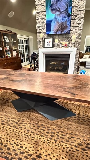 Delivered this 11’ walnut dining table just in time for hosting Thanksgiving. This was two rough slabs just a few weeks ago, and now the grain and voids have created a one-of-a-kind beauty. The modern, geometric base adds drama to the whole room. We love it! Wood from @dmg.hardwoods Finish from @rubiomonocoatusa Base from Econ Welding in Wauconda, IL #madetoorder #woodworking #customfurniture #smallbusiness #bts #diningtable | New England Table Company