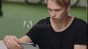 young businessman using tablet computer brainstorming engineers design mobile phone application sharing creative ideas for communication app in multi ethnic office